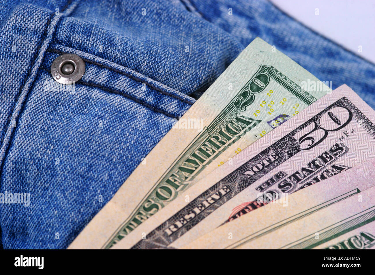 Dollars and Denim Jeans Stock Photo - Alamy