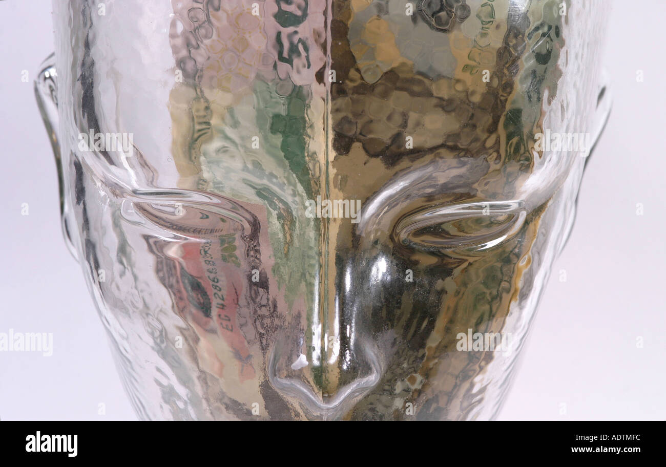 Dollar notes inside glass head full face view Stock Photo - Alamy