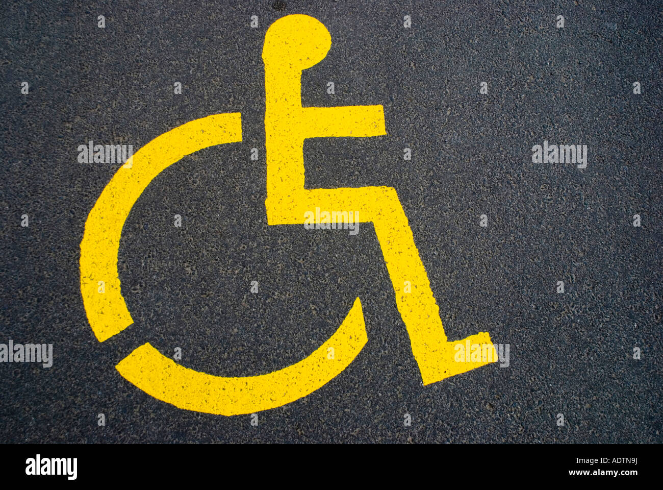 Disabled logo painted on parking area Stock Photo - Alamy