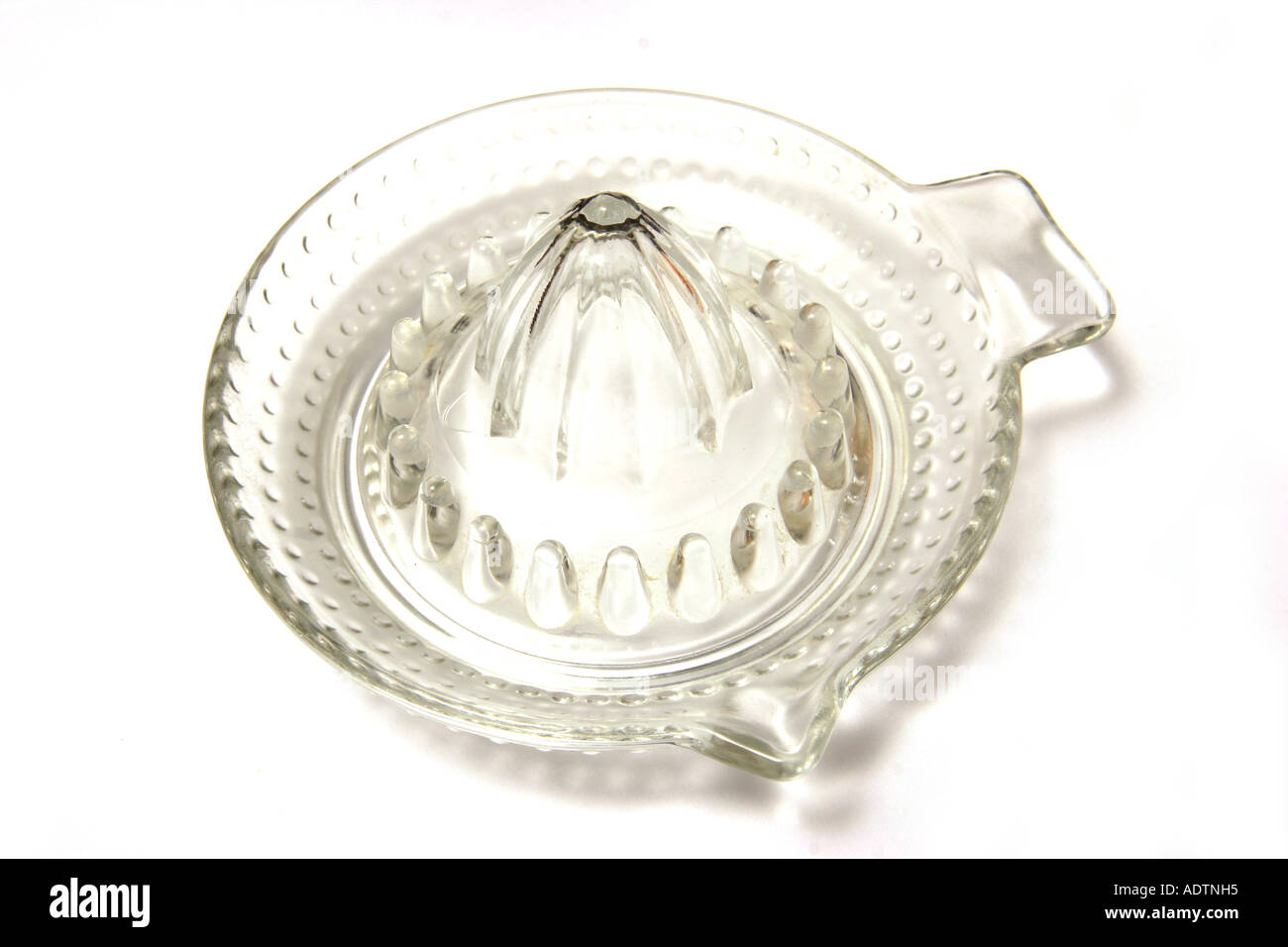 Glass juice extractor on a white studio background Stock Photo - Alamy