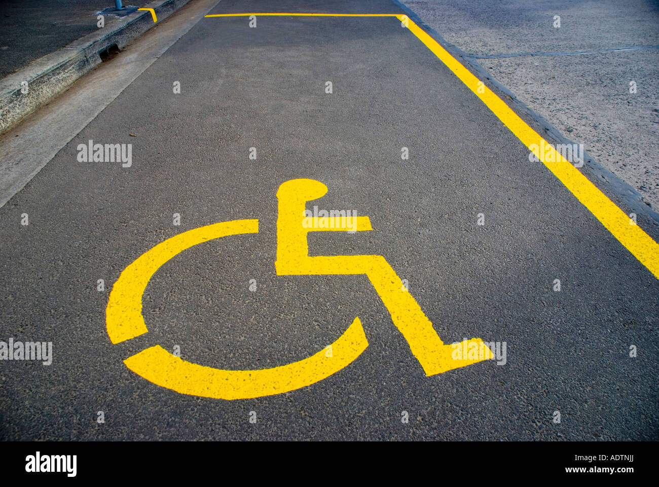 Disabled logo painted on parking area Stock Photo - Alamy
