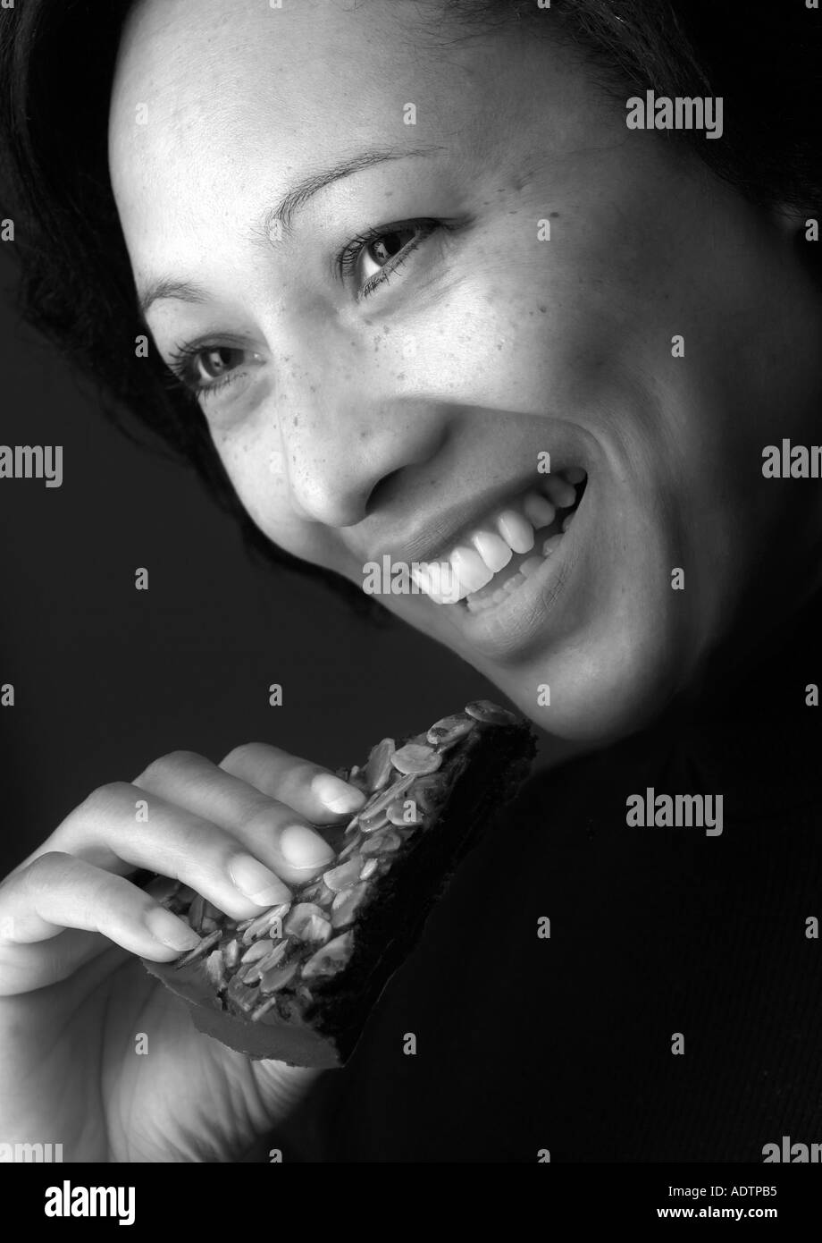 Woman eating cake Stock Photo - Alamy