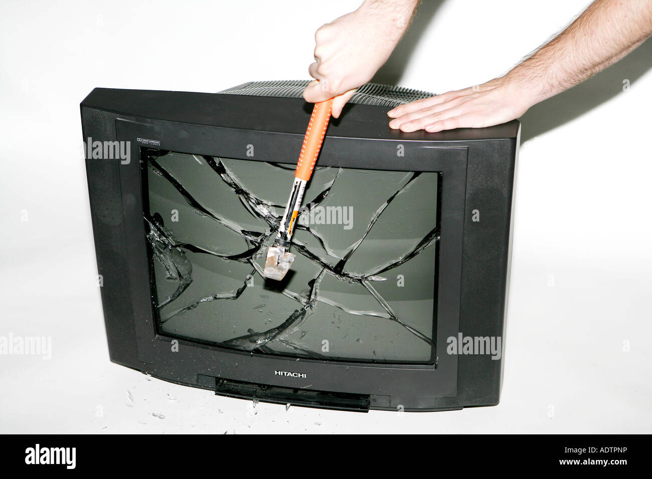 Young Man Smashing Television Model Released Stock Photo - Alamy