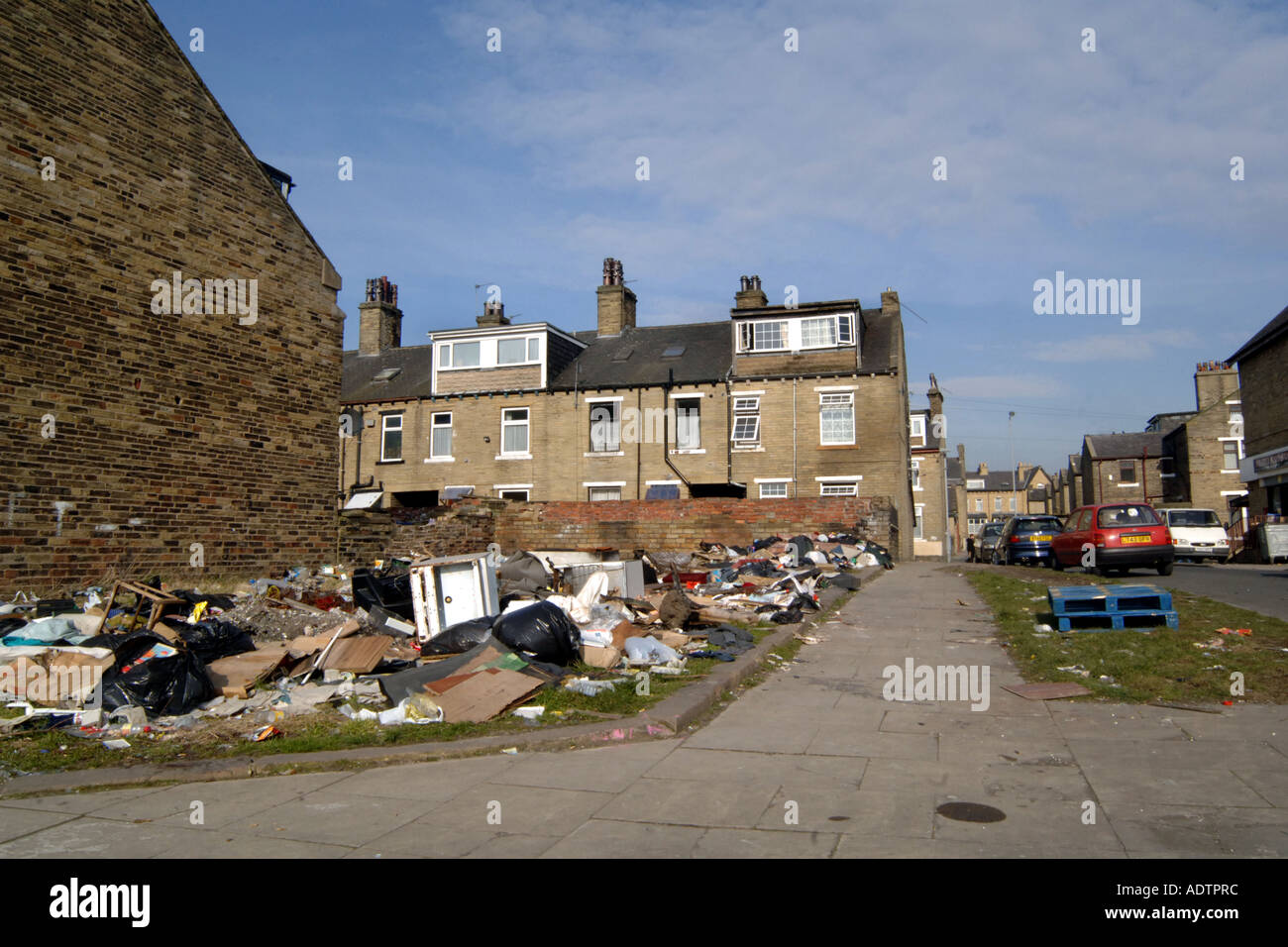 Dirty run down street near a big area of rubbish Bradford Stock Photo ...