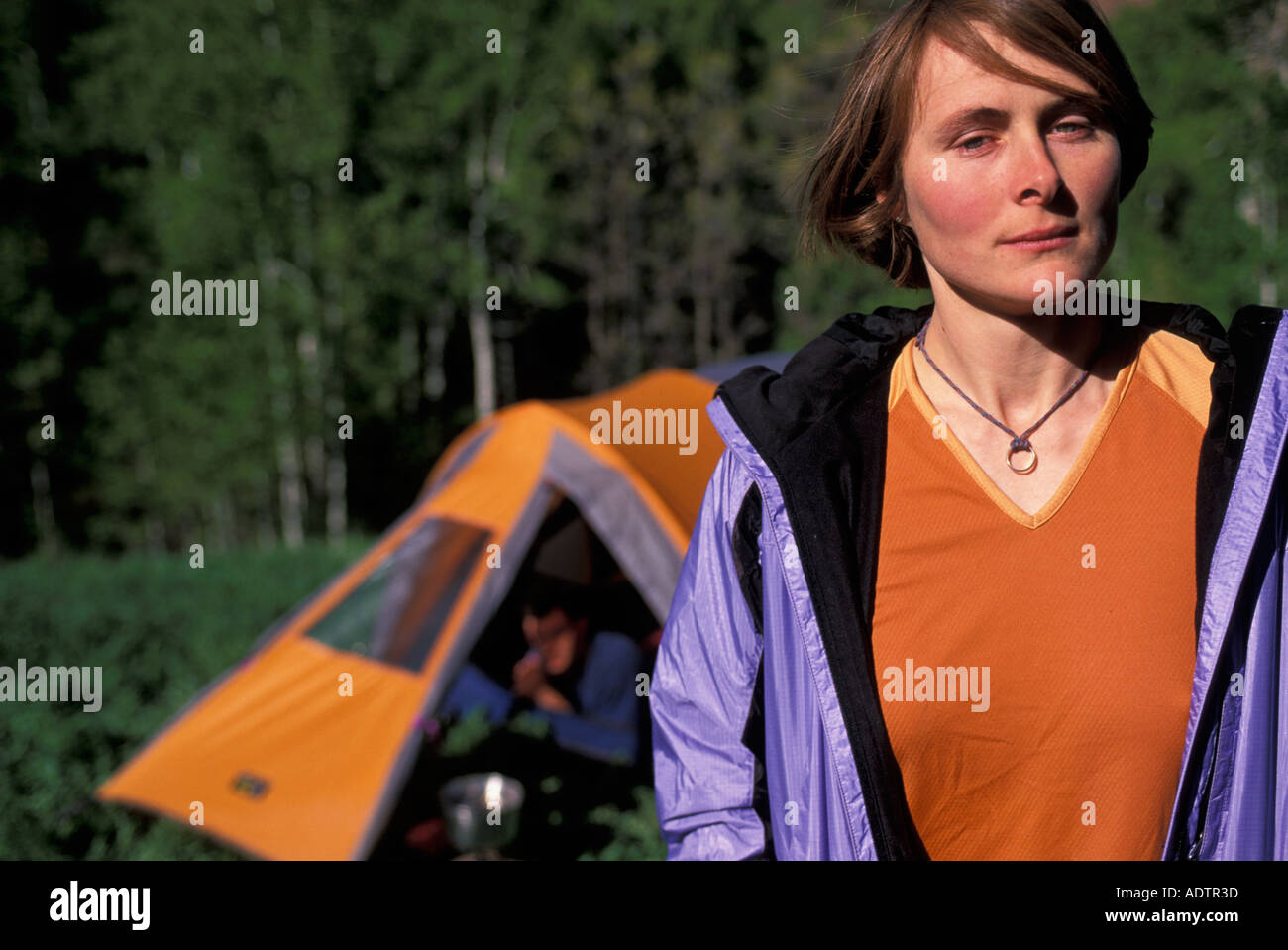 Woman camping in the wilderness Stock Photo - Alamy
