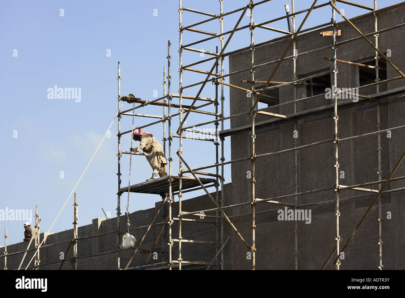 worker on scaffolding, Dubai Stock Photo - Alamy