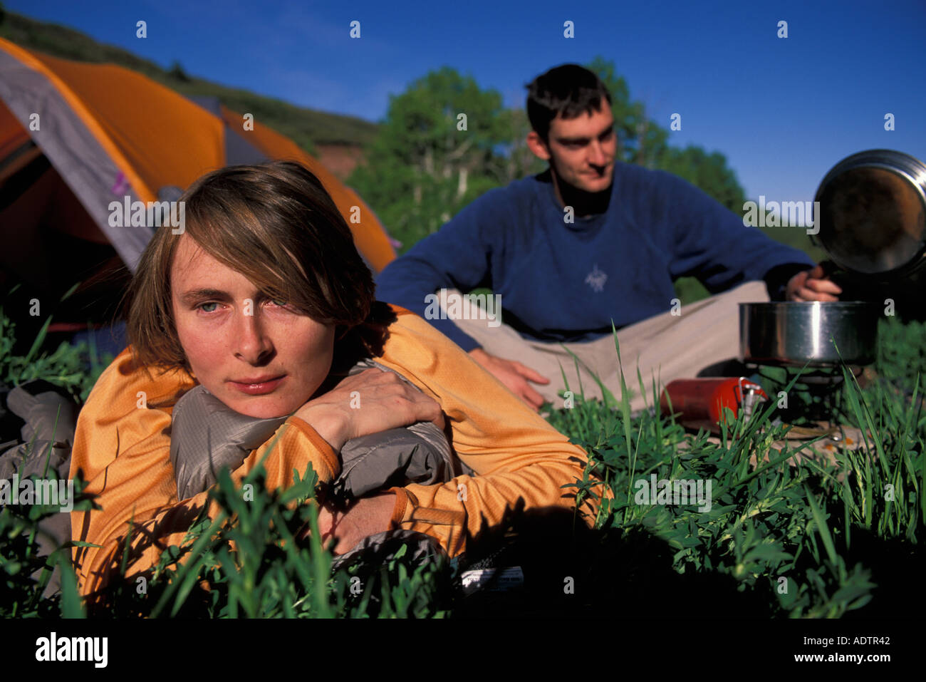 Woman camping in the wilderness Stock Photo - Alamy