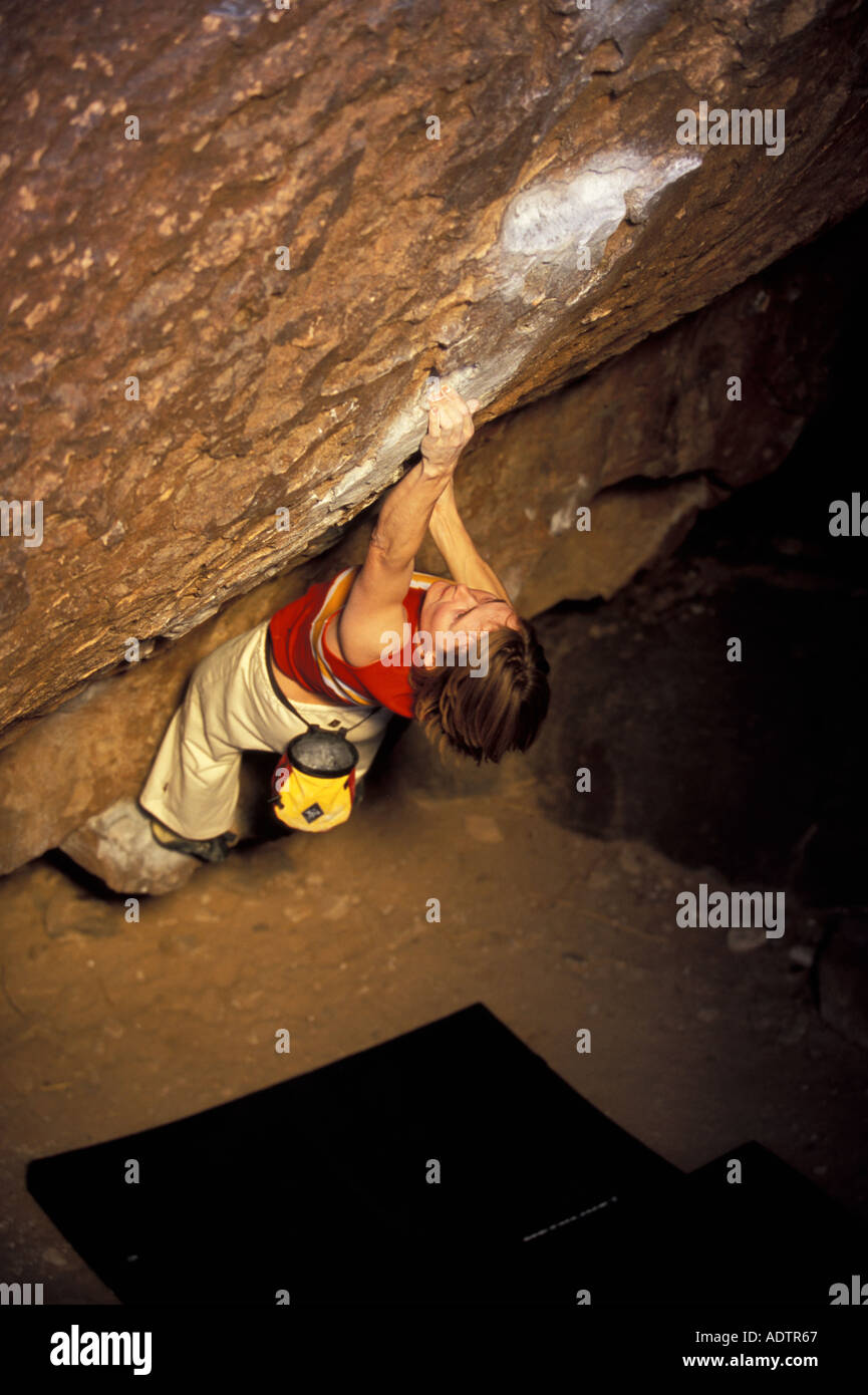 Woman bouldering on a steep overhanging boulder problem Stock Photo - Alamy