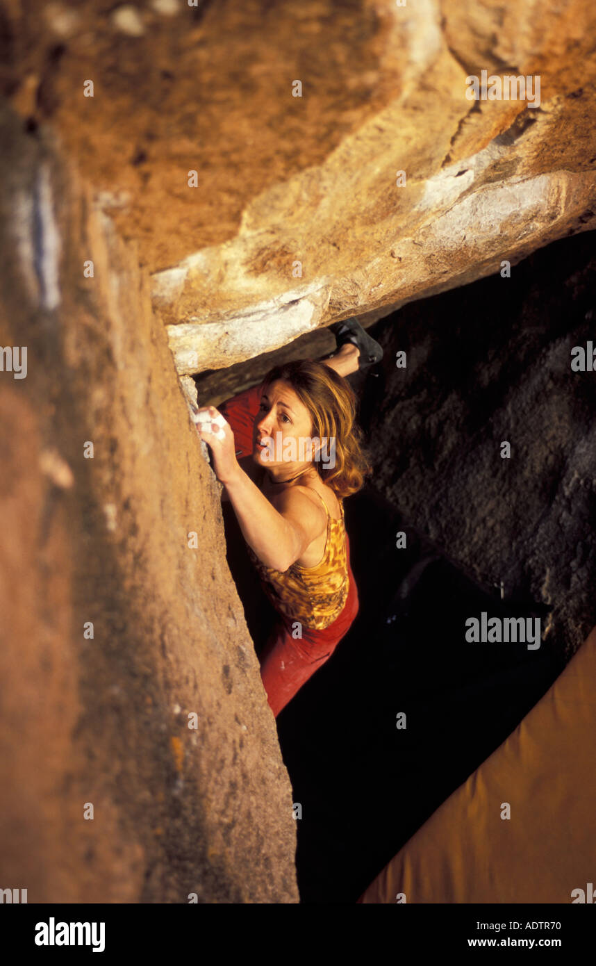 Woman bouldering on a steep overhanging boulder problem Stock Photo - Alamy