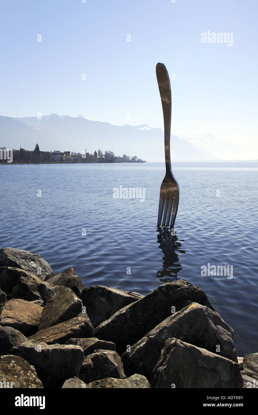 sculpture of a giant fork stuck in water - Switzerland Stock Photo - Alamy