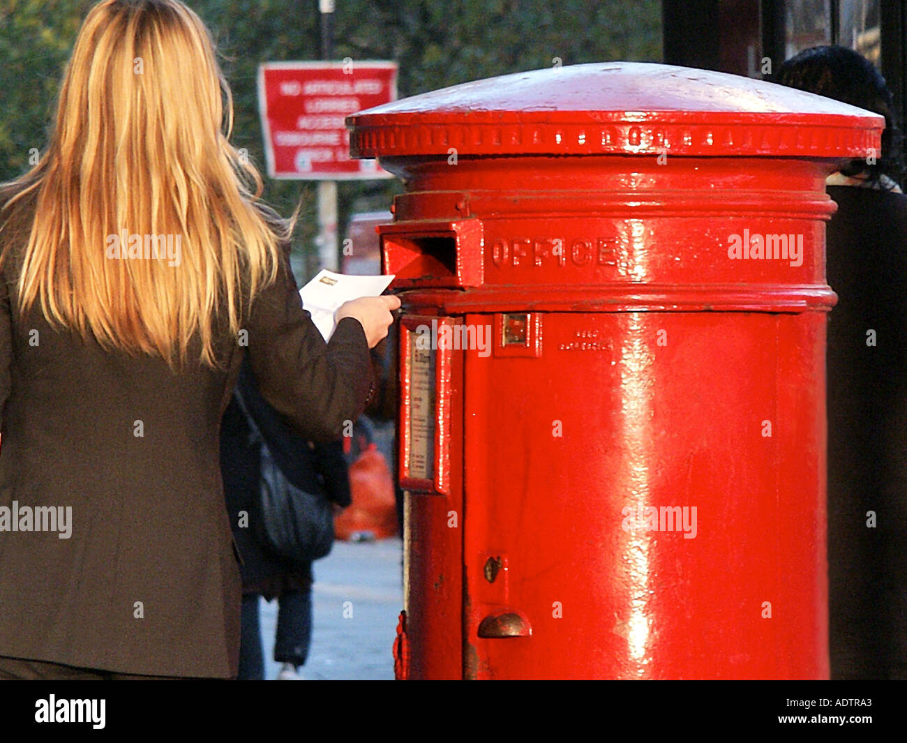 Woman posting letters letterbox hi-res stock photography and images - Alamy