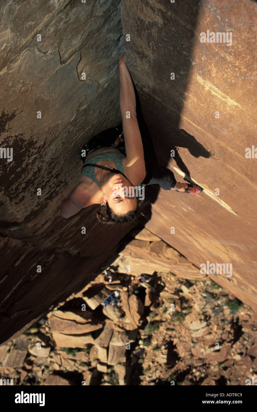 Female rock climber crack climbing in Indian Creek near Moab, Utah ...
