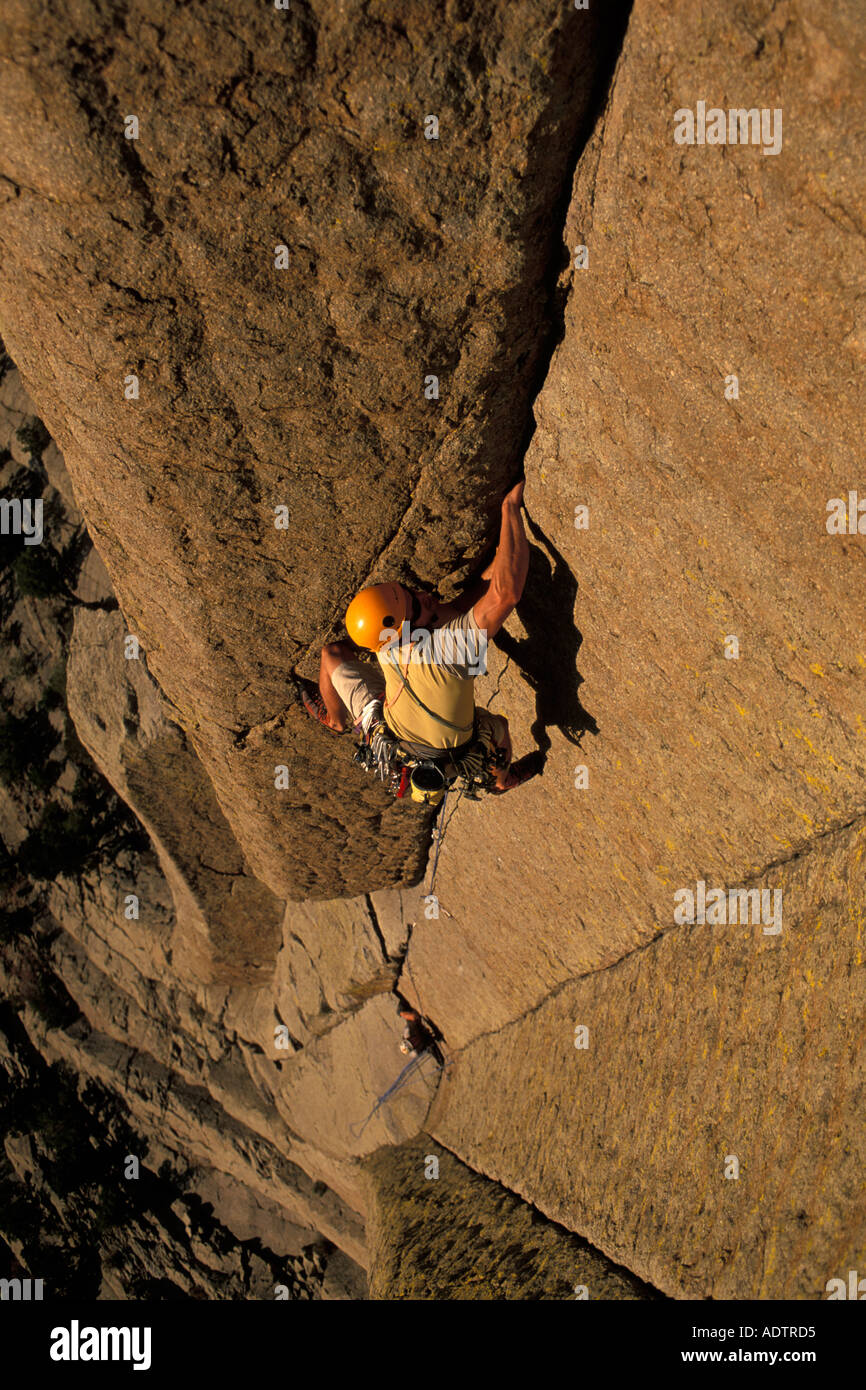 Male rock climber ascending a steep route on Devil's Tower in Wyoming ...