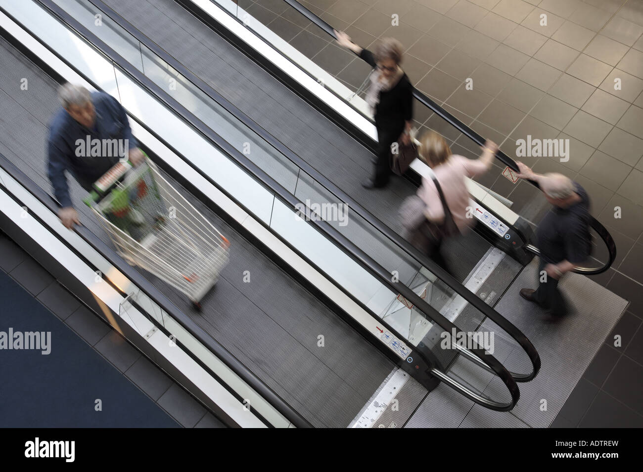 people on escalator Stock Photo - Alamy