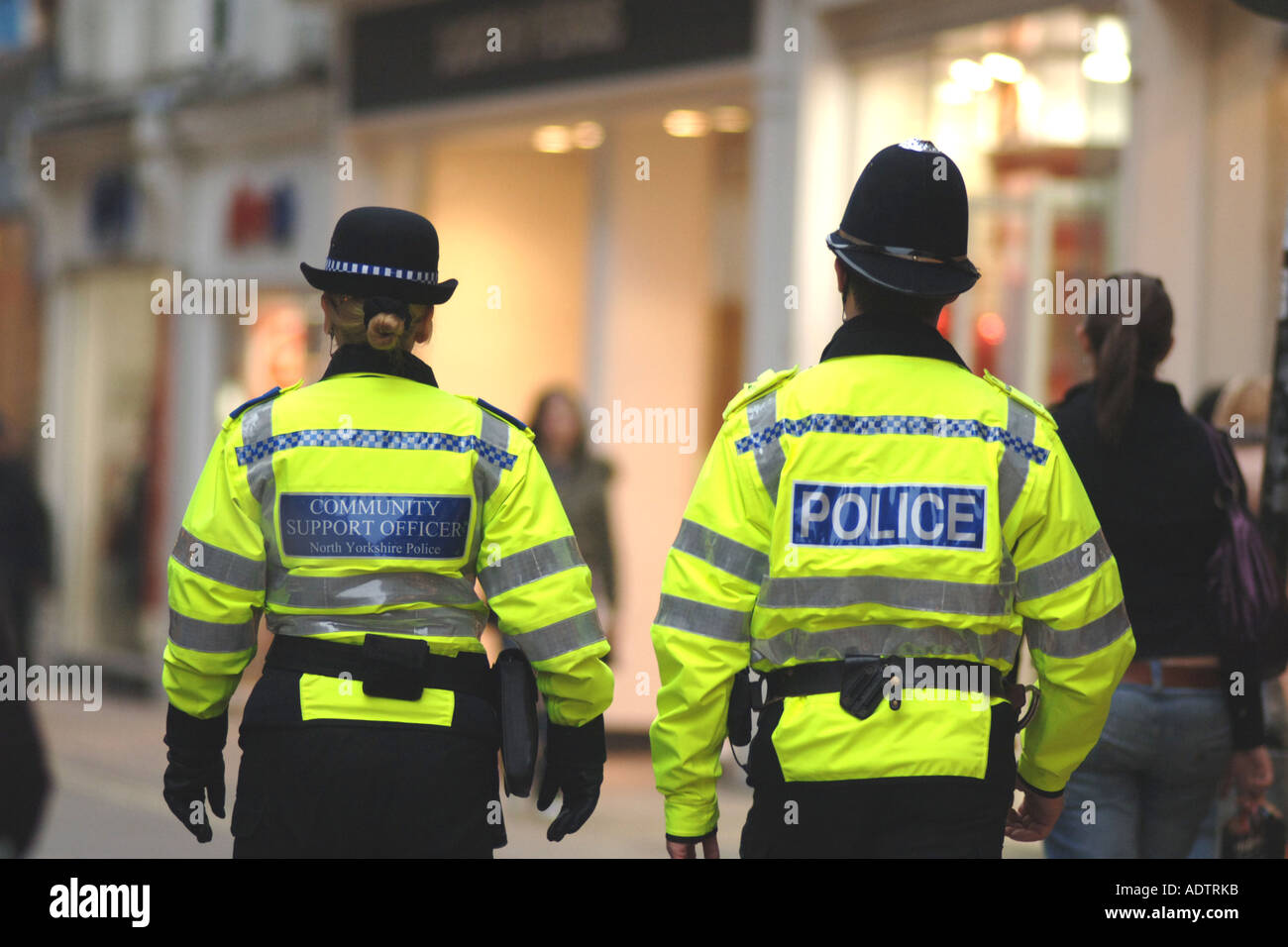 Policeman and Community Safety Officer patrol the High Street as it ...