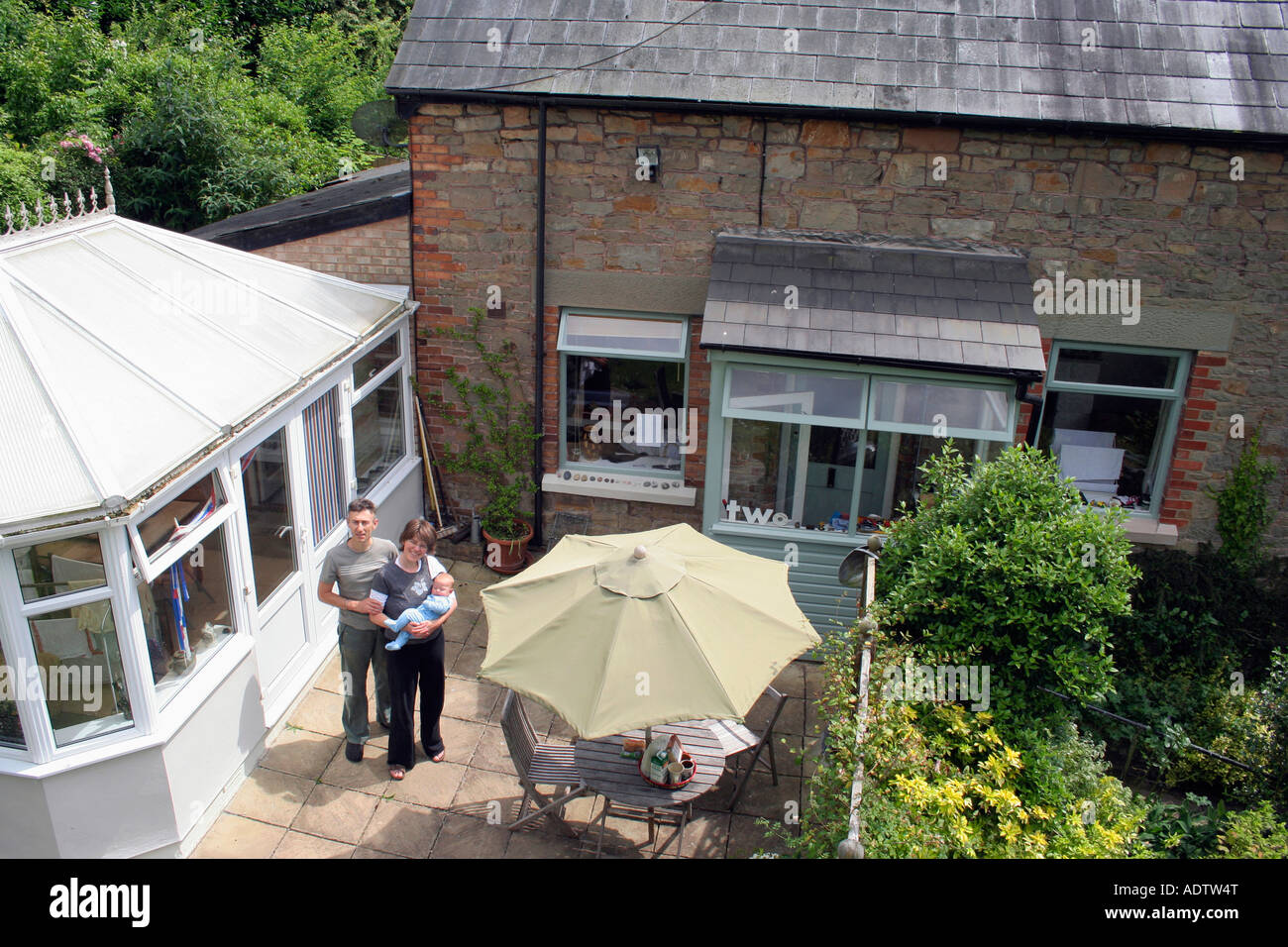 Family standing outside rural home hi-res stock photography and images ...