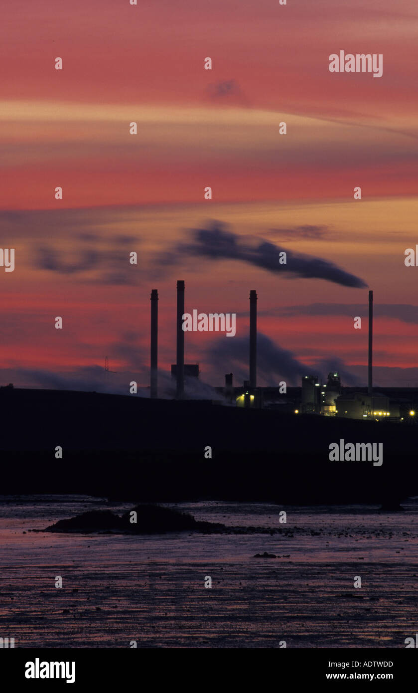 Industry Paper mill chimney stacks and mudflats at sunset The Swale ...