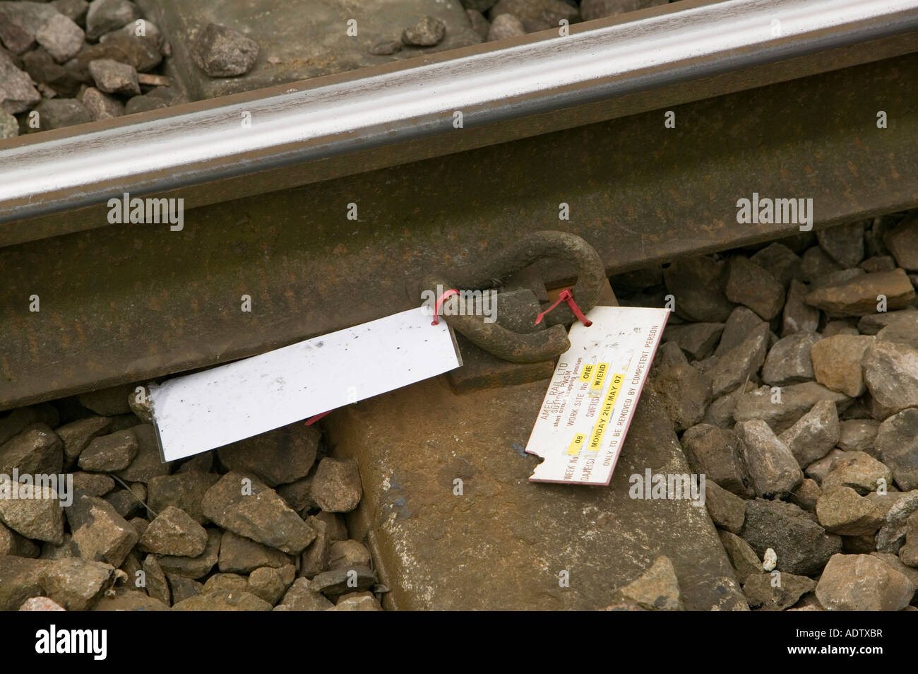 A maintenance tag on a railway track in London Stock Photo - Alamy