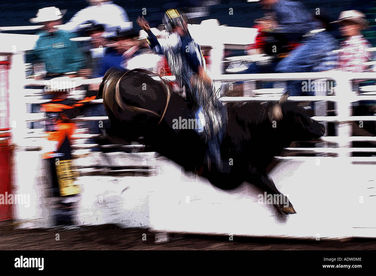 A blurred image of a bull rider at a indoor rodeo Stock Photo - Alamy