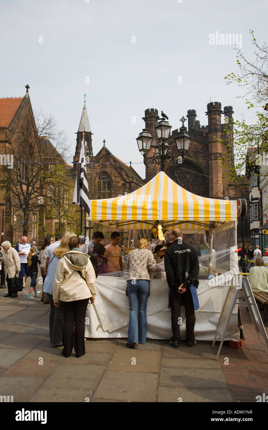 Outdoor French Market stalls busy with people shopping under yellow ...
