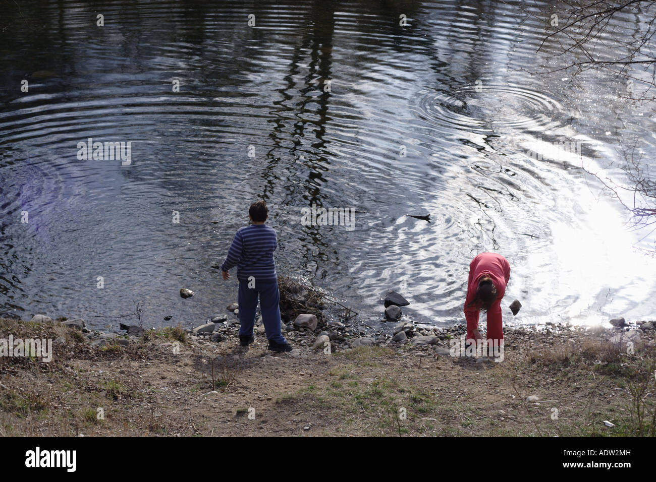 Children throwing rocks hi-res stock photography and images - Alamy