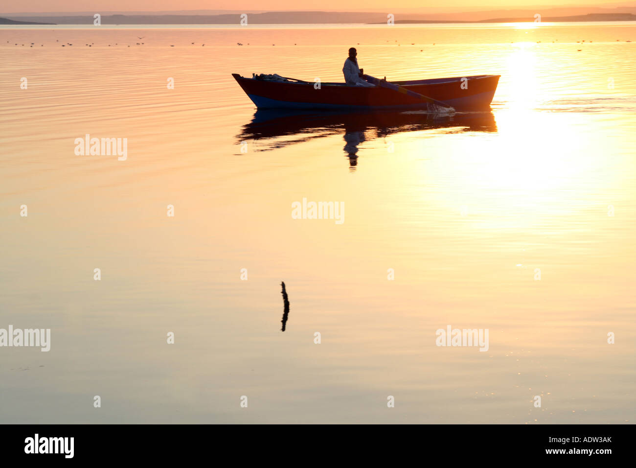 Magical Golden Sunset - Small Boat Stock Photo - Alamy