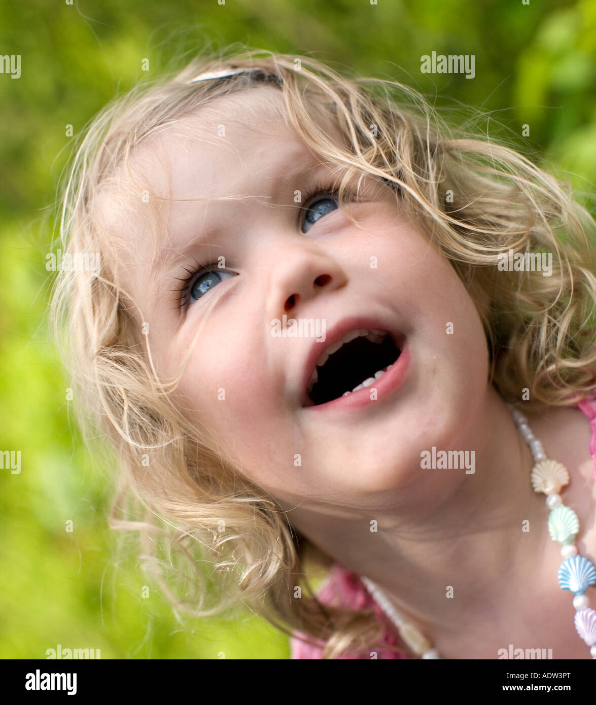 Girl looking in wonder Stock Photo - Alamy