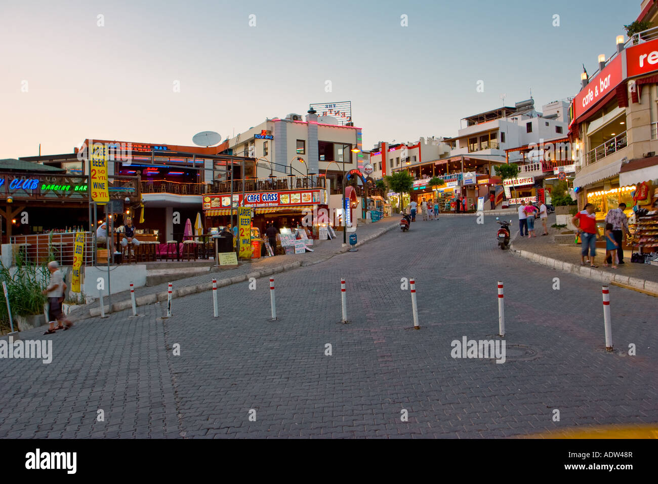 People walking down the road at night in Gumbet doing shopping until ...