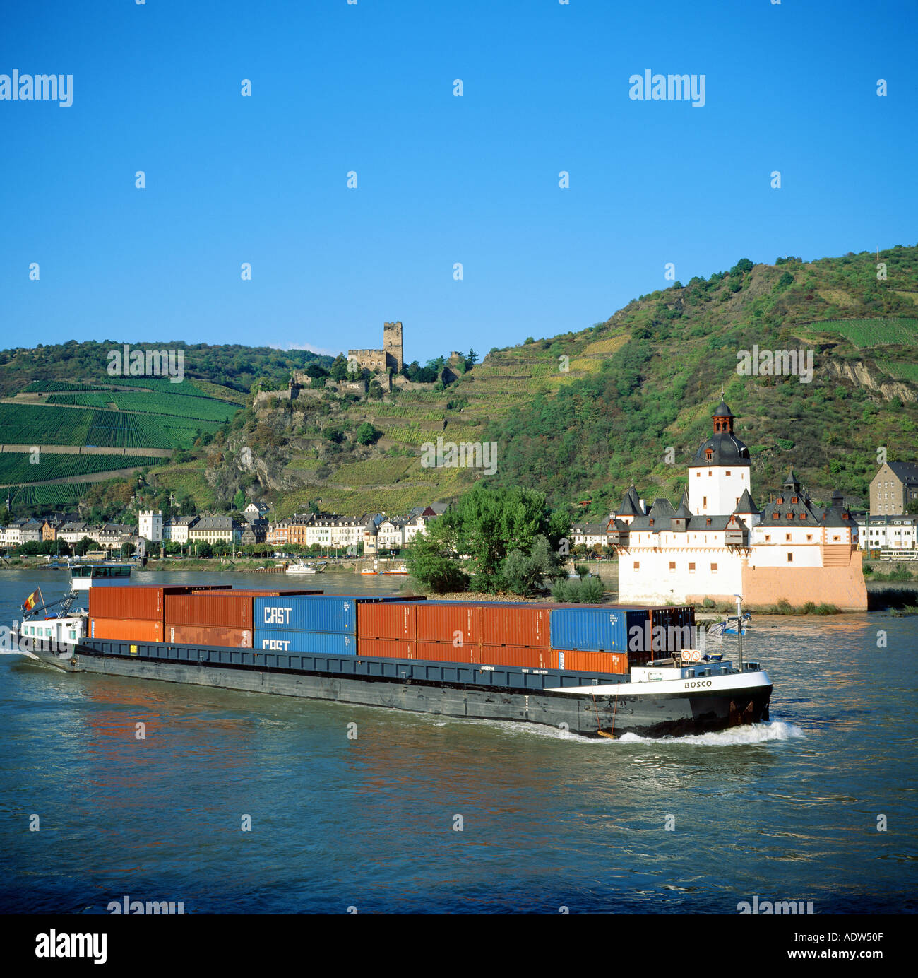 BARGE LOADED WITH CONTAINERS ON THE RHINE RIVER PASSING THE PFALZ TOLL ...