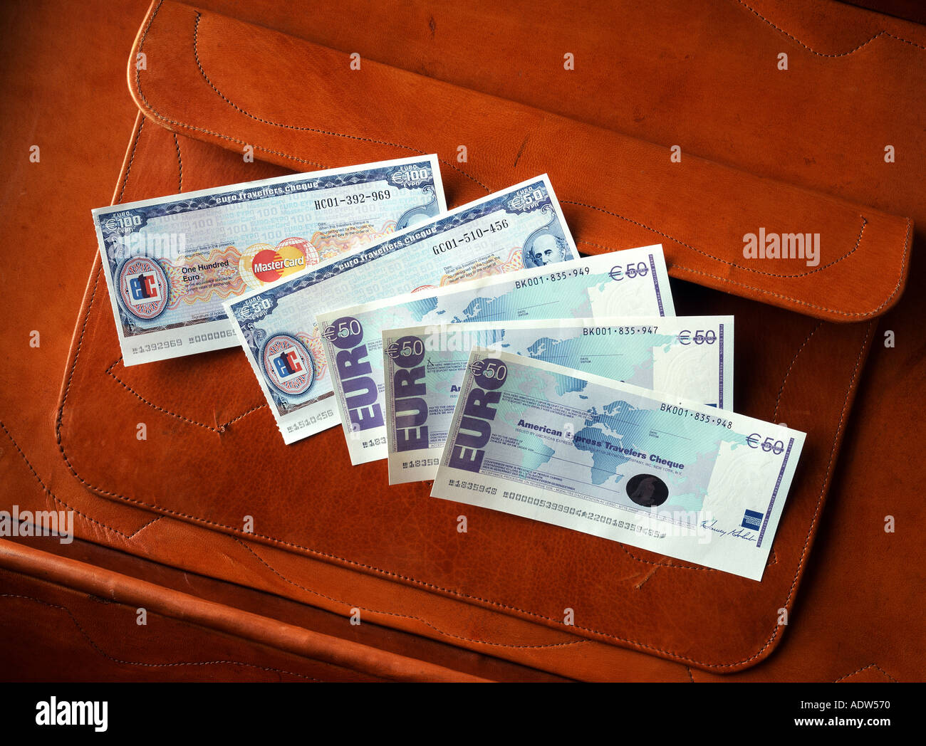 50 AND 100 EURO TRAVELLERS CHEQUES ON A BROWN LEATHER SUITCASE Stock ...