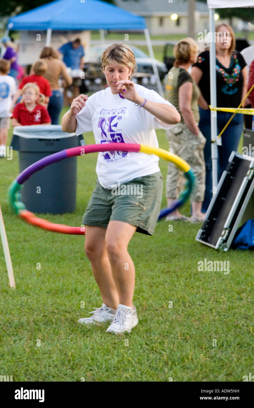 Young woman competes in hoola hoop contest at American Cancer Society's ...