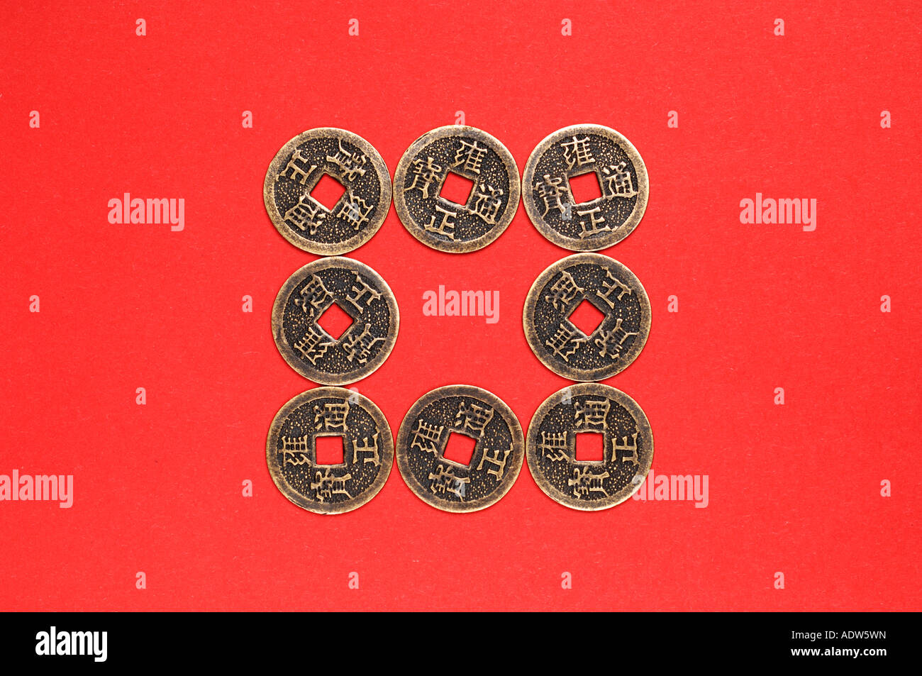 Eight chinese coins on red background Stock Photo - Alamy