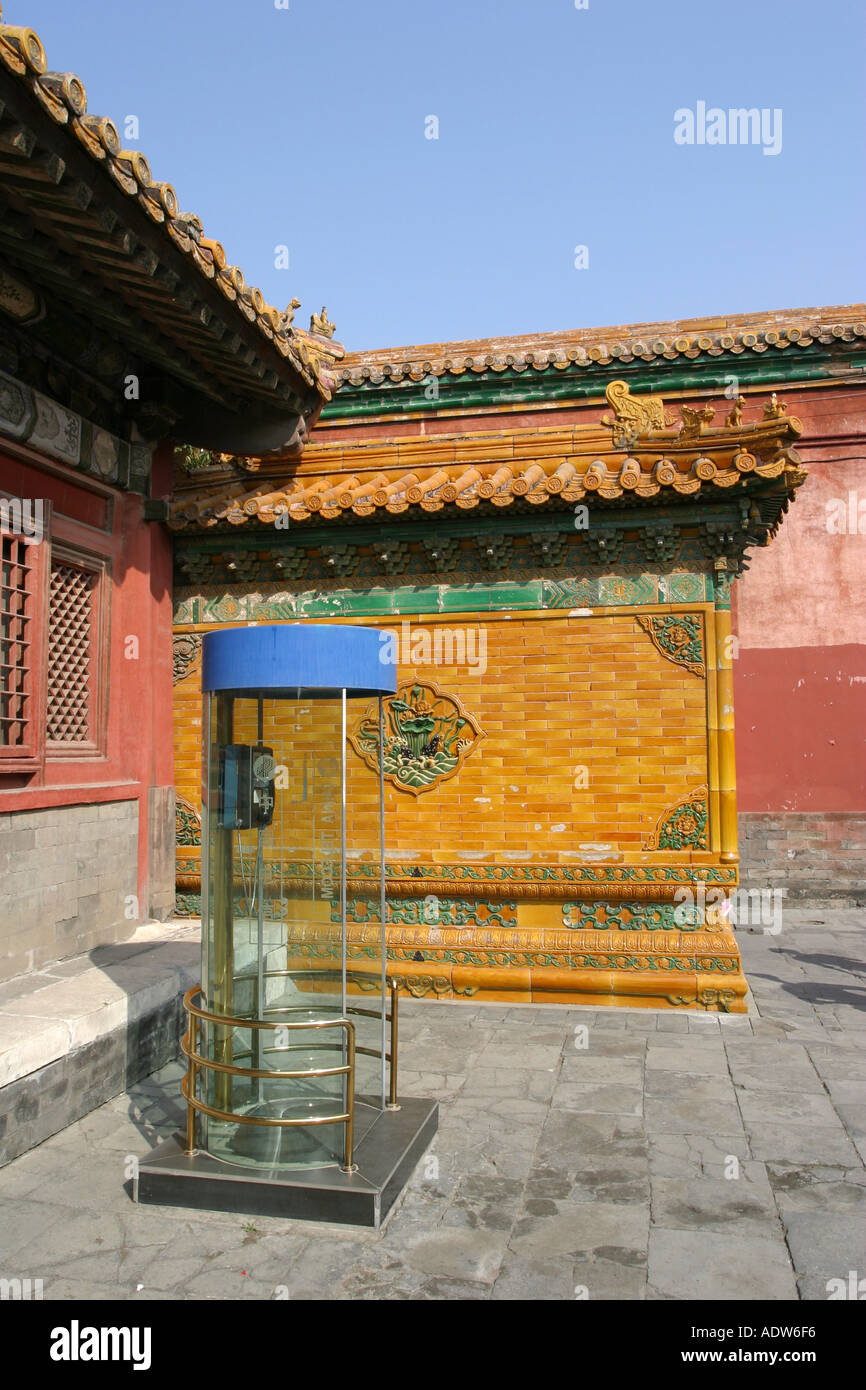 A modern China telecom public phone box in the ancient Forbidden city ...