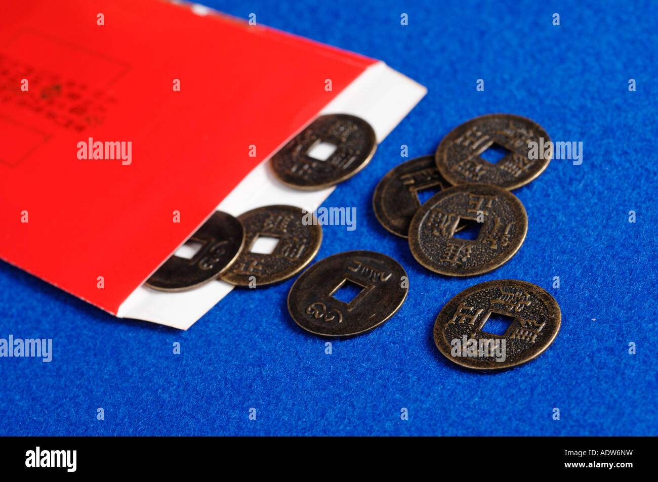 Eight chinese coins spilling from lucky red ang pow envelope Stock ...