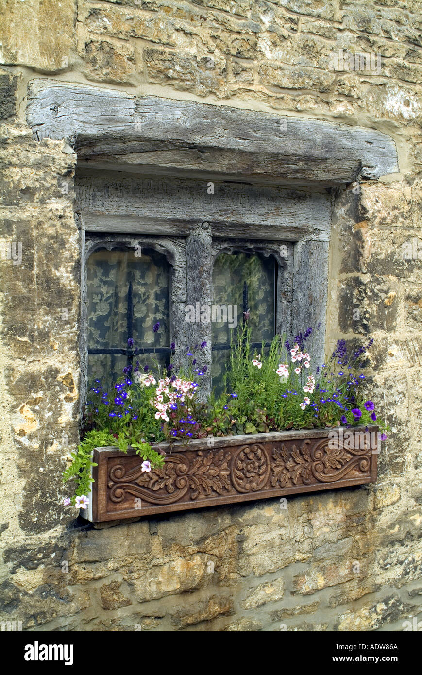 UK England Cotswolds Wiltshire Castle Coombe old stone cottage window ...