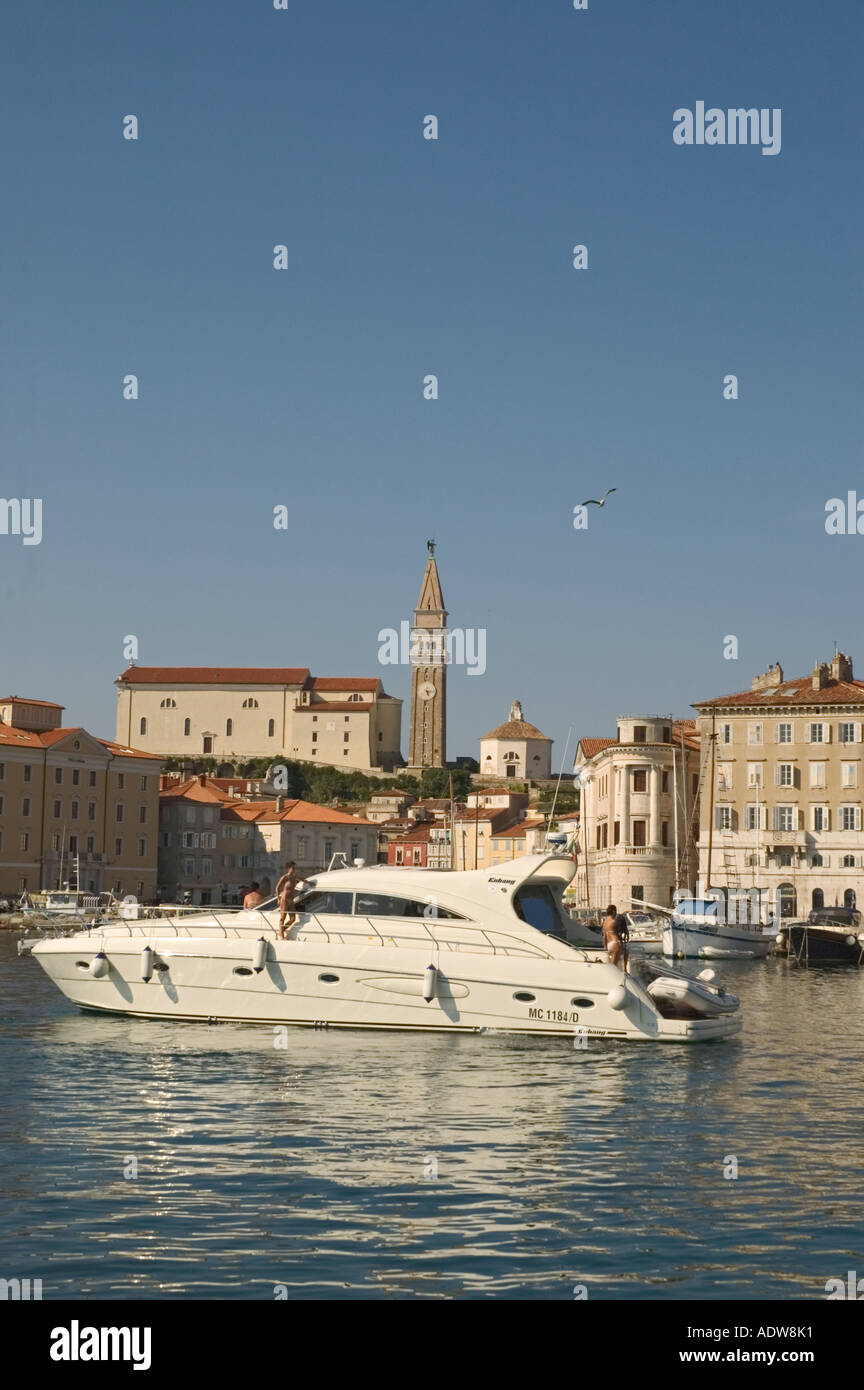 Slovenia Piran motor yacht in harbor church of St George belfry in ...