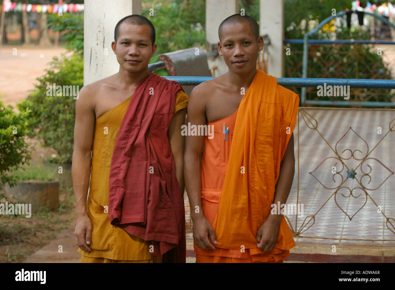 Two Cambodian male young buddhist monks pose for a travel photo at a ...