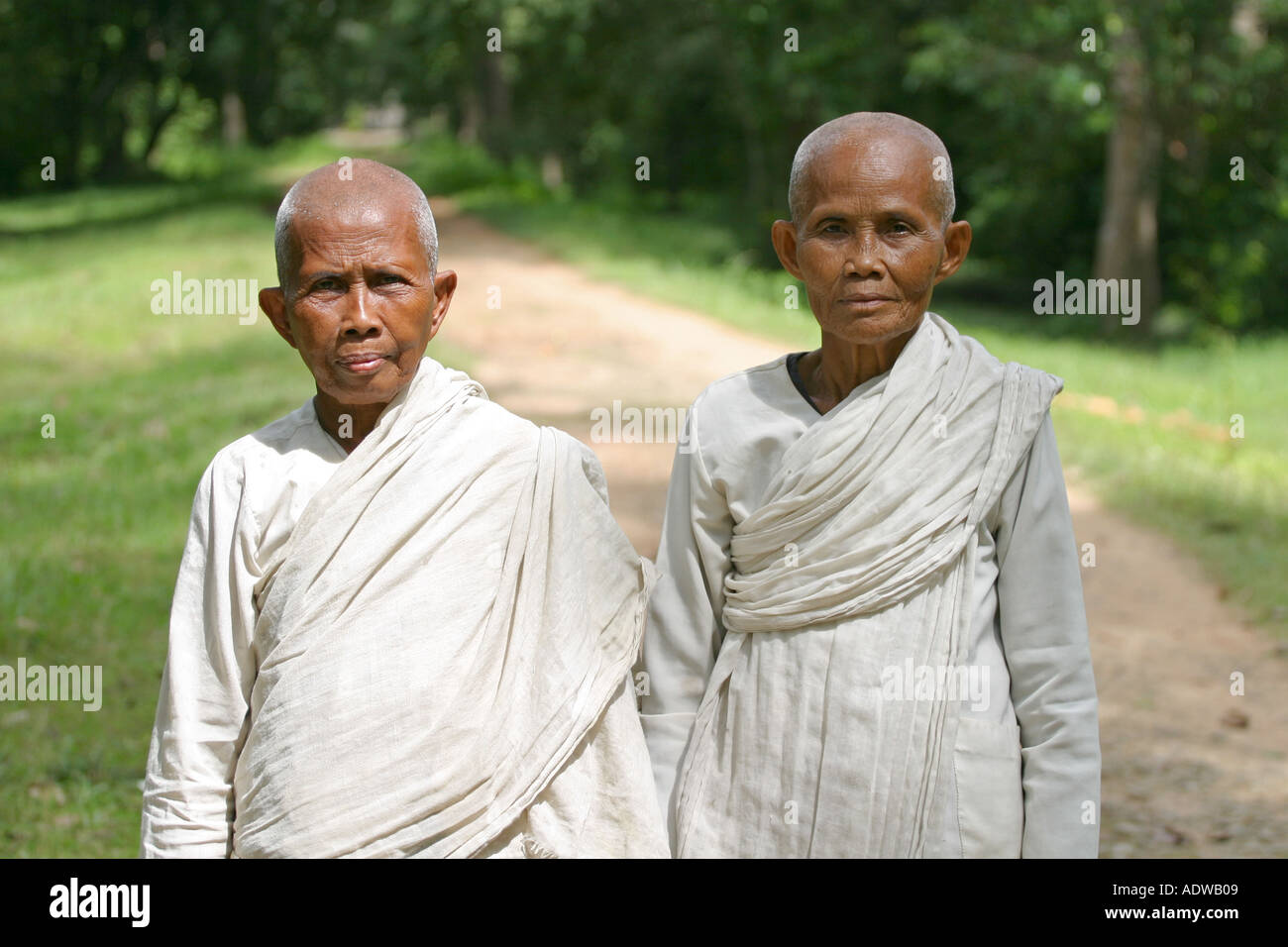 Two native Cambodian village women pose for a photo in the jungle near ...