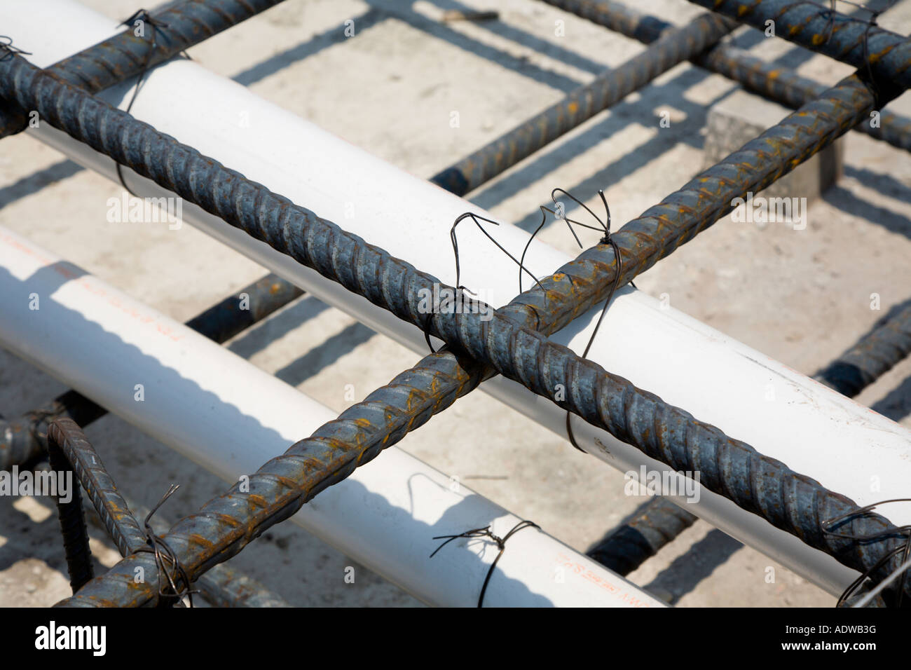 Rebar and PVC tied together on construction site Stock Photo - Alamy