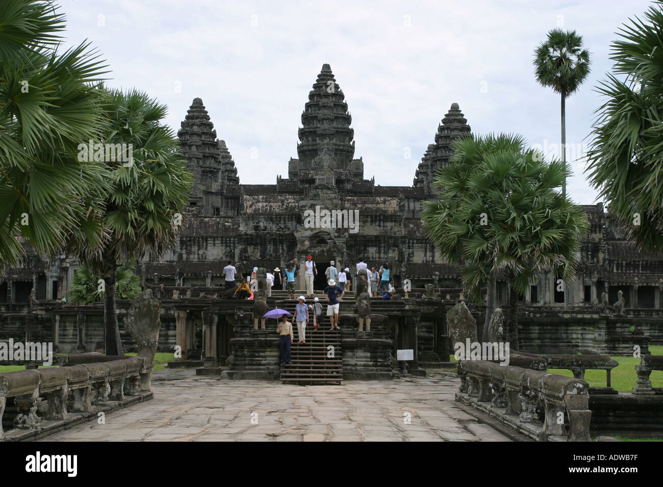 Tourists crowd the Ancient Angkor Wat temple as they explore the ...