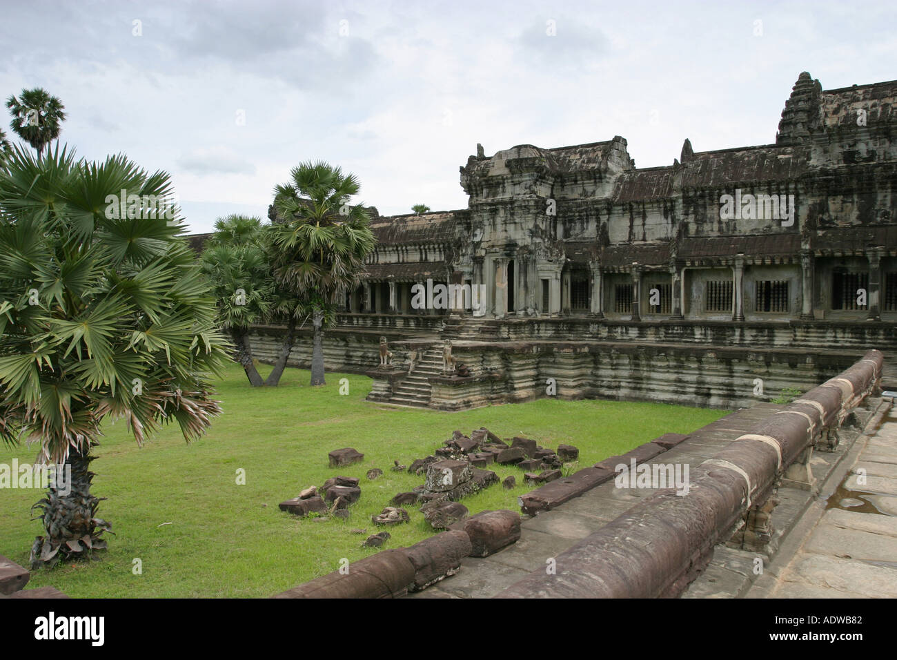 World famous landmark monument Angkor Wat temple with lush green gardens in monsoon season Siem ...
