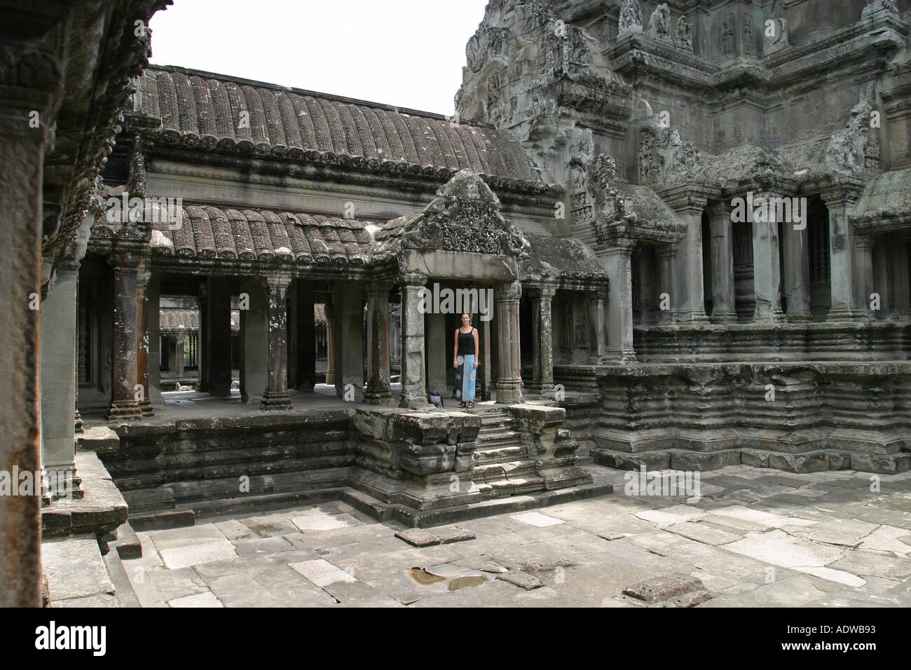 A female tourist adds a sense of scale to the grand architecture and ...