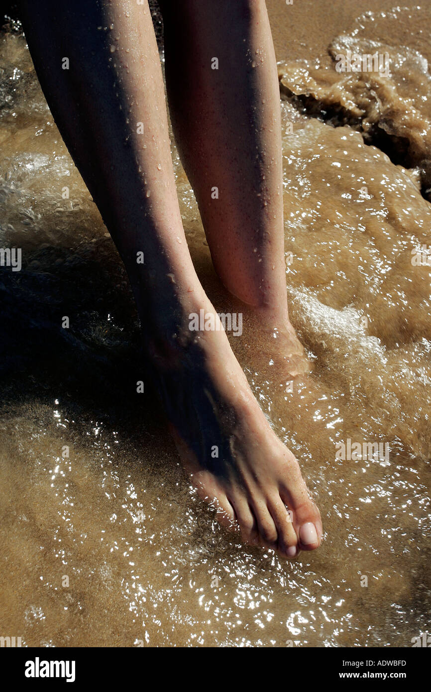 pair of feet on wave Stock Photo - Alamy