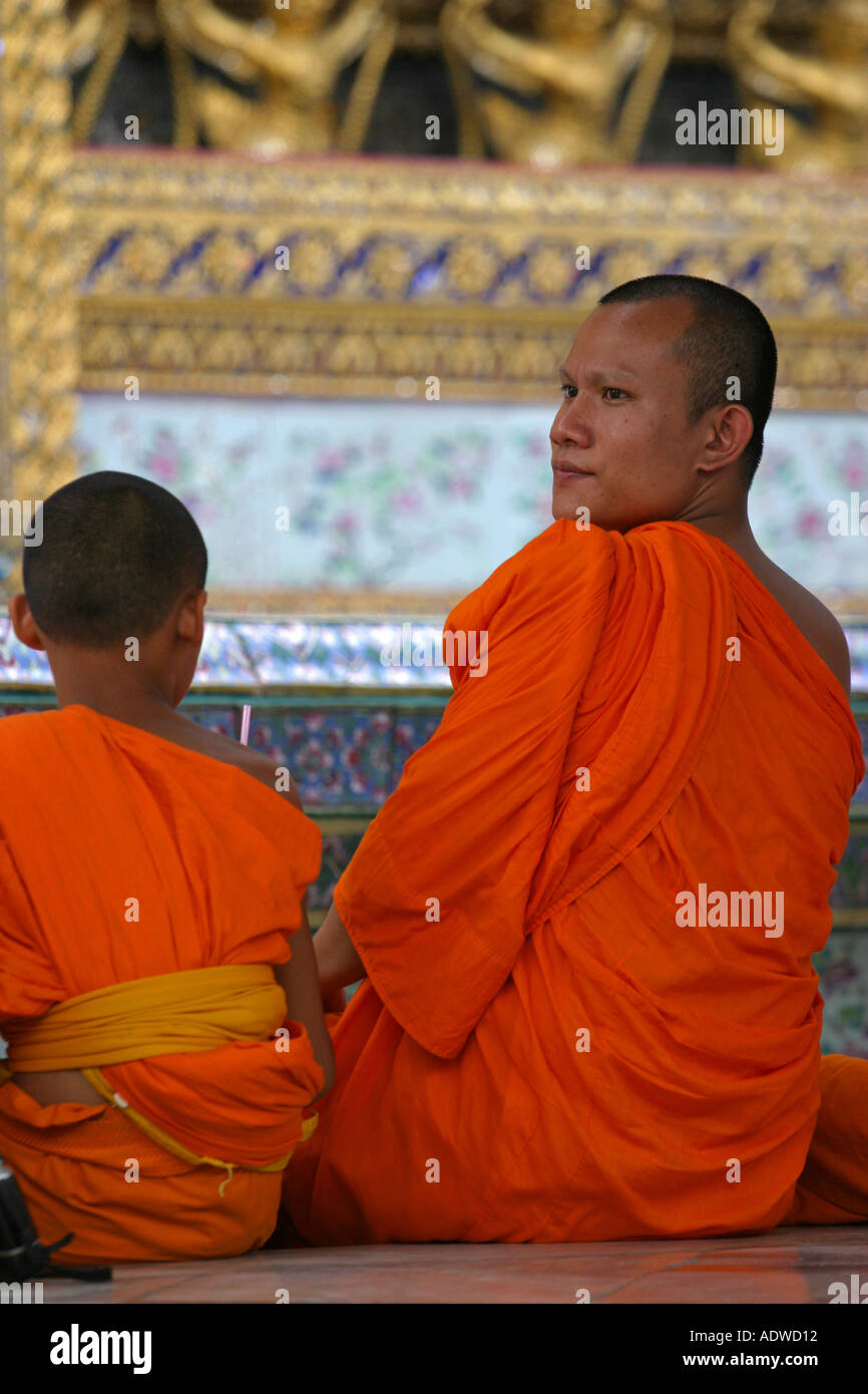 Buddhist monk teacher and student in classic iconic orange robes at the ...