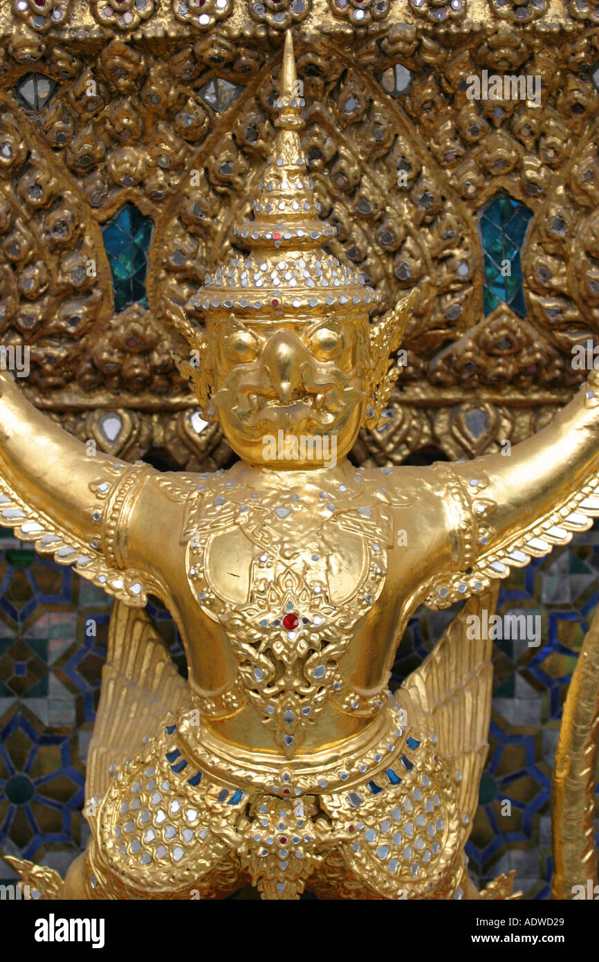A golden guardian angel statue glints in the sun at the Grand Palace ...