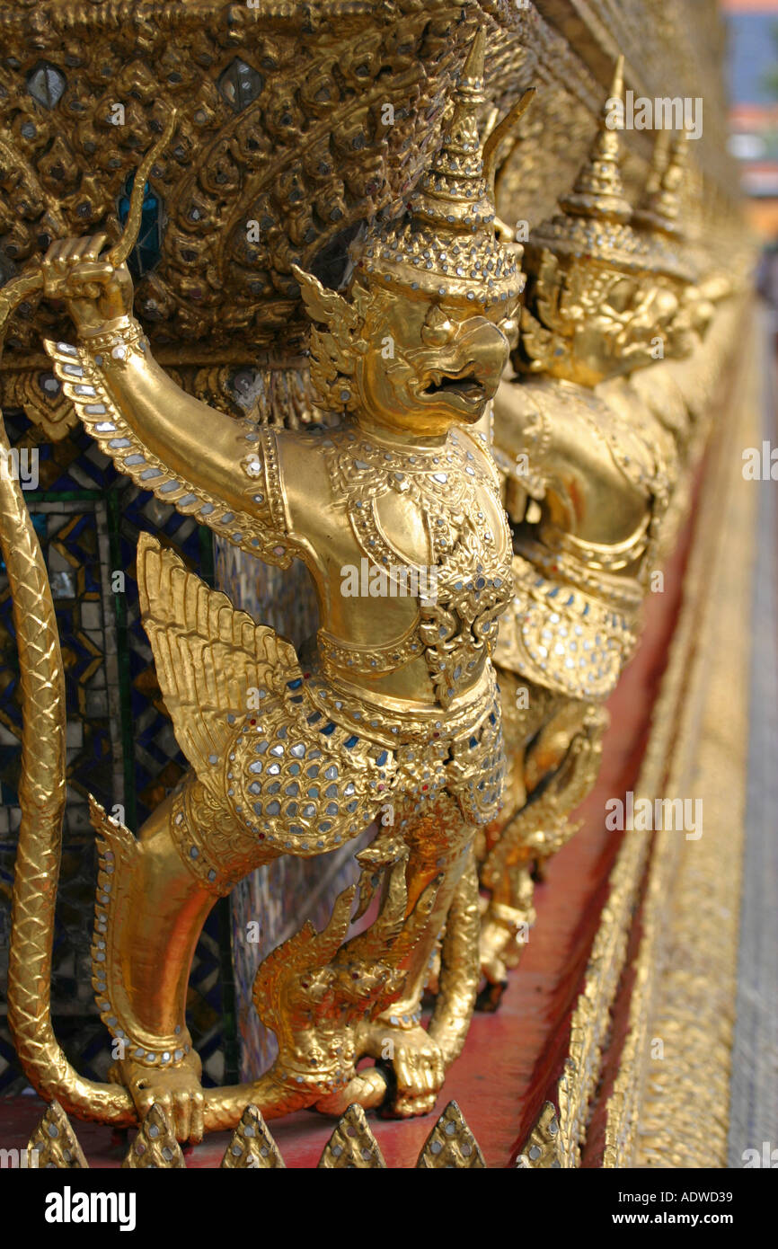 Close up detail of a golden guardian angel statue at the Grand Palace ...