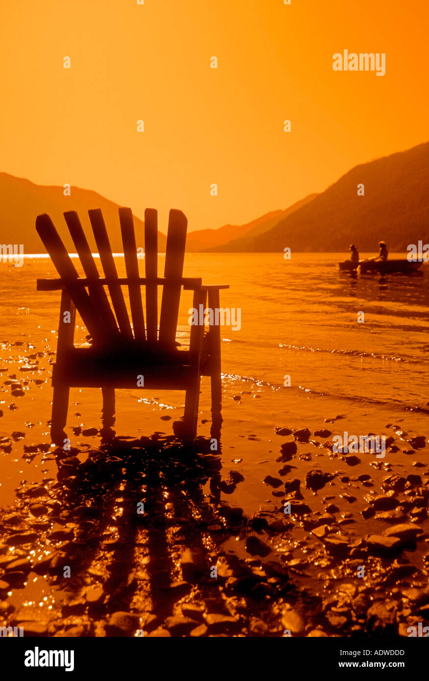 Beach chair at sunset Stock Photo - Alamy