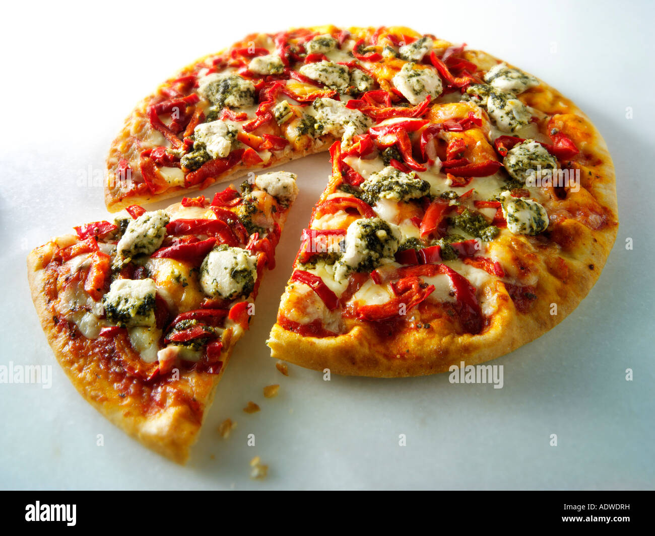 Whole chicken and pepper topped pizza Stock Photo - Alamy