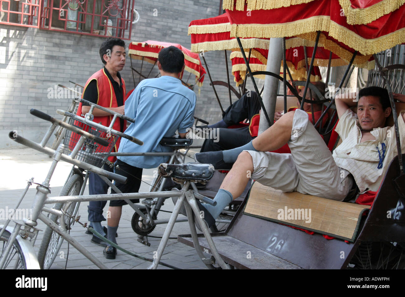 Chinese pedicab drivers hi-res stock photography and images - Alamy