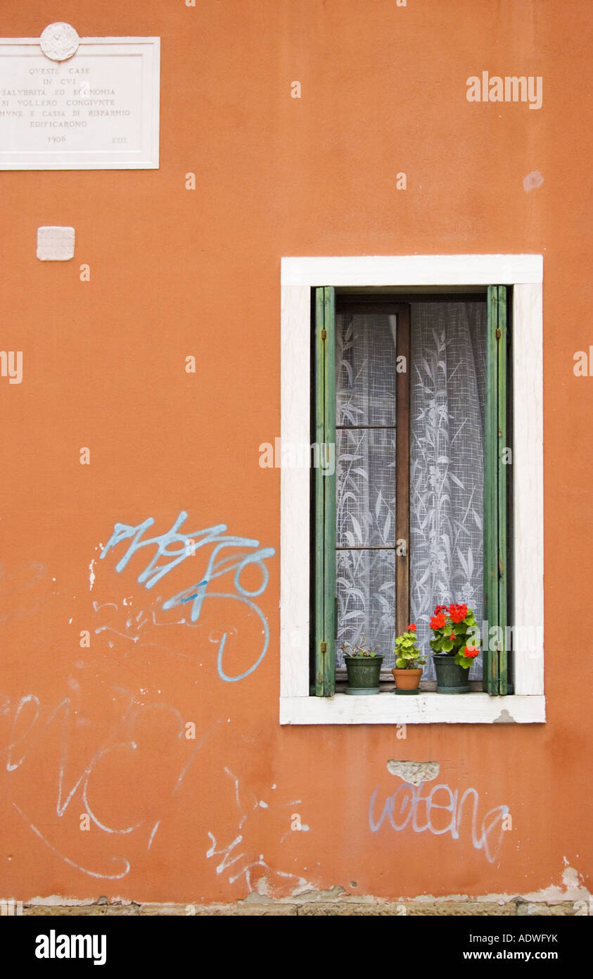 Venetian window and graffiti Stock Photo - Alamy